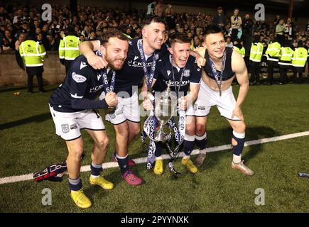 Dundee's Luke McCowan celebrates with the trophy after winning the ...