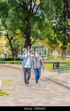 Gay couple walking together outdoors Stock Photo - Alamy