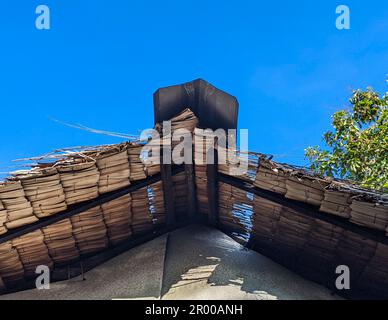 Nipa palm dried leaves and bamboo made the roof of the house to be a ...