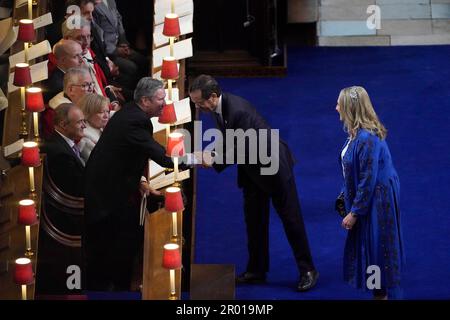 Queen Camilla shakes hands with Sir Gerald Ronson during her visit to ...