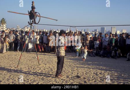 a Jester and artist at the Chowpatty Beach in the city centre of Mumbai ...