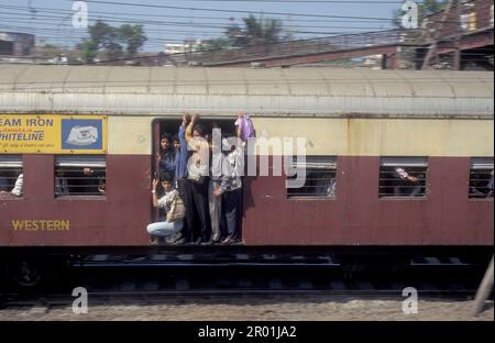 a overloaded Train on the way to the Mumbai Railway Station or ...