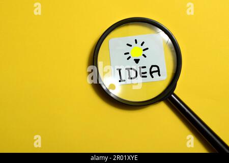 Magnifying glass with light bulb icon. Concept creative idea and ...