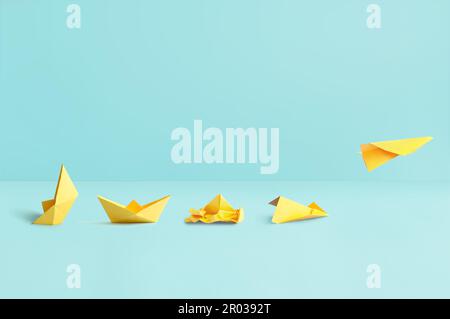 Paper boat sinking transformation into a paper airplane, from failure ...