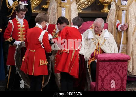 The Pages of Honour, including Prince George (bottom left), arrange the ...