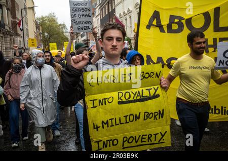 An anti-monarchy protestor clenches his fist as he demonstrates in ...