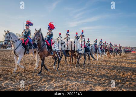 The long line of Carabinieri ride their horses as they leave the field ...