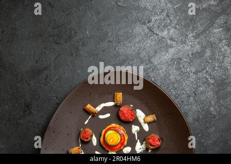 top view cooked squashes designed meal inside plate on grey floor ...