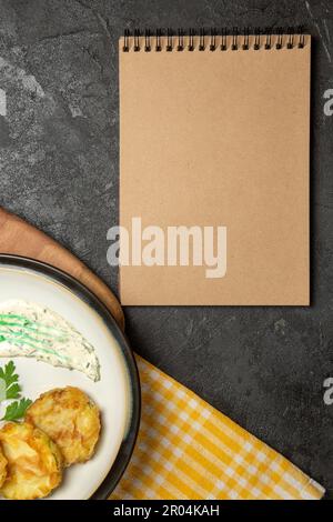 top view delicious cooked squashes slices inside plate on a dark grey ...