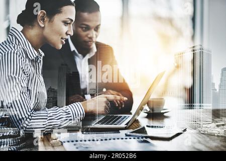 They work best when they work together. two businesspeople working ...