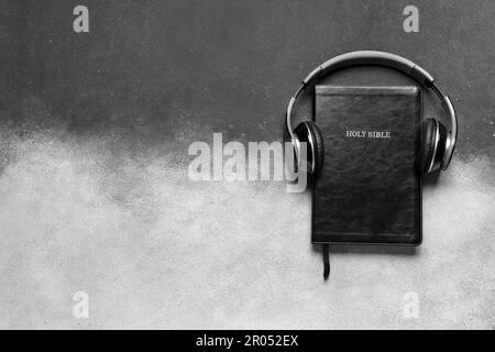 Holy Bible with headphones on grunge background Stock Photo - Alamy