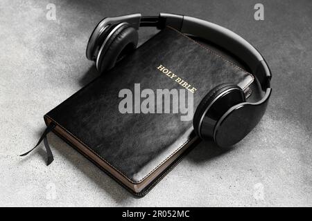 Holy Bible with headphones on grunge background Stock Photo - Alamy