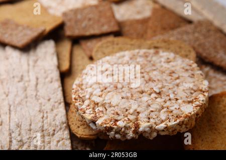 Fresh rye crispbreads, crunchy rice cakes and rusks with different ...