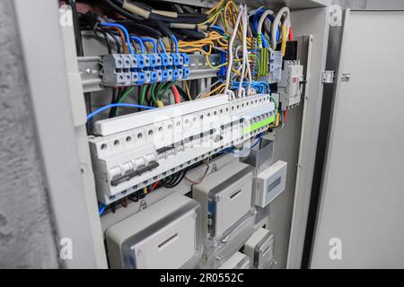 Panel with electric meters and many wires in fuse box Stock Photo - Alamy