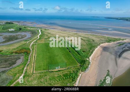 Aerial view of Pilmore Strand and the St Itas GAA pitch near Youghal in ...