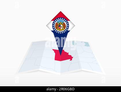 Folded paper map of Missouri U.S. State with flag pin of Missouri ...