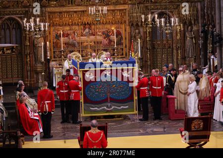 Queen Camilla (right) watches as King Charles III is behind a anointing ...