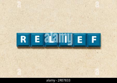 Tile alphabet letter with word comfort in red color rack on wood ...