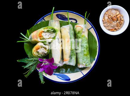 Vietnamese nem spring rolls in leaf with sauce Stock Photo - Alamy