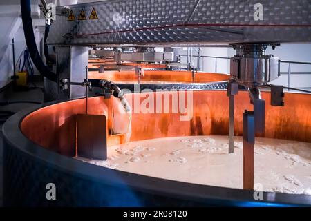 Vats with milk to make cheese and by-products such as whey Stock Photo ...