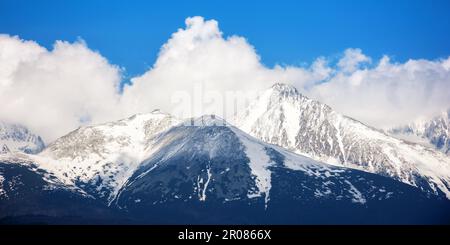 background image of high tatra peaks in spring. sunny scenery with ...