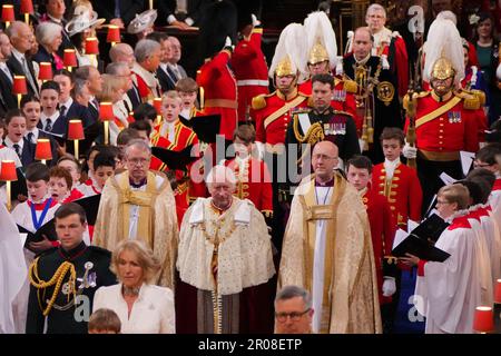 King Charles III is followed by Page of Honour Charles van Cutsem (left ...