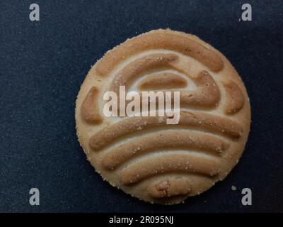 Round shape Indian biscuits on black background popularly known as Chai ...