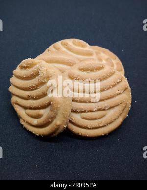 Round shape Indian biscuits on black background popularly known as Chai ...