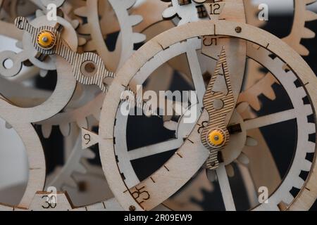 A wooden mechanical clock with exposed gears Stock Photo - Alamy