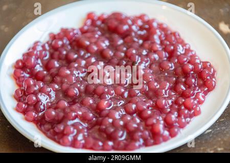 Red wine sago with vanilla cream, traditional cultural dessert from ...