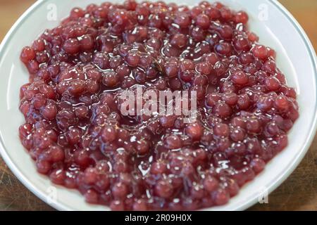 Red wine sago with vanilla cream, traditional cultural dessert from ...