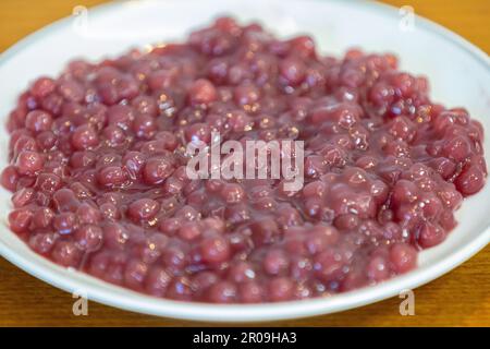 Red wine sago with vanilla cream, traditional cultural dessert from ...