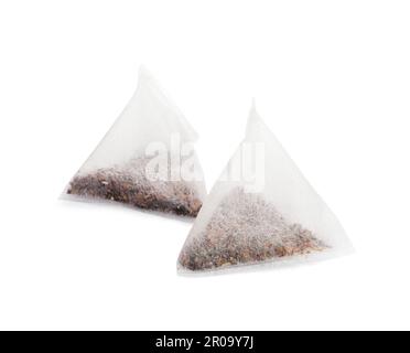 New pyramid tea bags on white background Stock Photo - Alamy