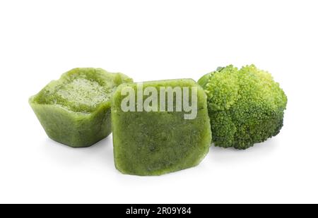 Frozen broccoli puree cube and fresh broccoli isolated on white Stock ...