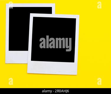 Polaroid photo frames on yellow background Stock Photo - Alamy
