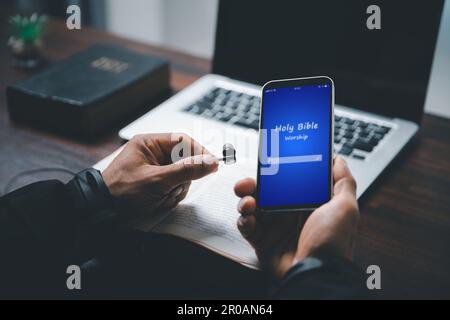 Christian online technology concept. Hands praying of christian with ...