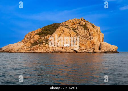 Rocky coastal of island Hon Tai, in the Bay of Mui Ca Heo, Vinh Hy ...