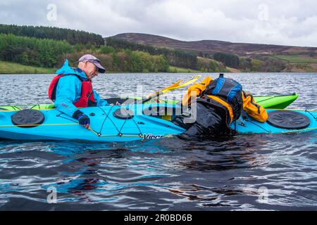 Sea kayakers practicing rescue techniques on a reservoir Stock Photo ...