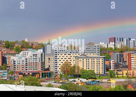 An amazing vibrant low rainbow appears briefly after heavy rain over ...