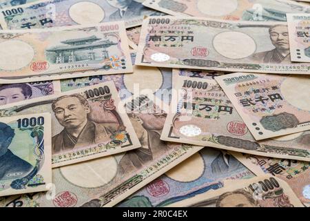 Japanese currency. View looking down at a pile of Japanese banknotes in ...