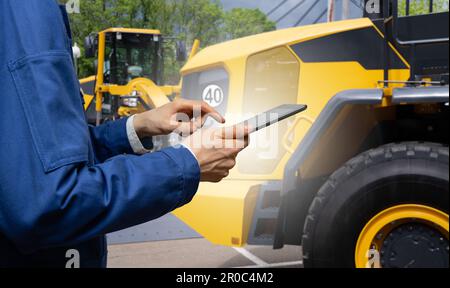 Fleet of yellow construction machines. High quality photo Stock Photo ...