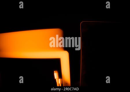 Diffuse Patterns view of laptop,Tablet of workspace in dark background ...