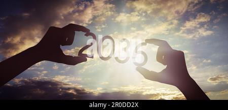 2036 - human hands holding black silhouette year number, gradient ...