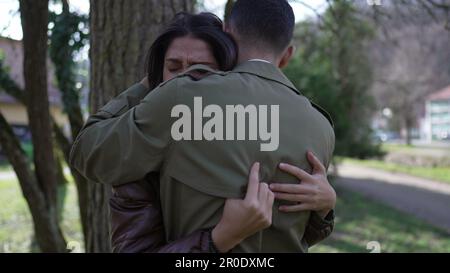 Empathic hug Man consoling woman suffering from mental pain and grief ...