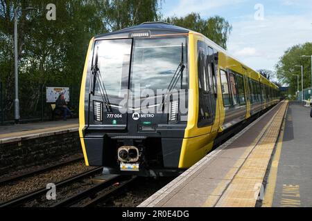 A new train Class 777 for Merseyrail service arrives at Maghull Station ...