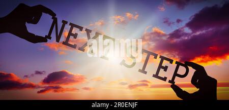 Next step - human hands holding black silhouette word, gradient ...