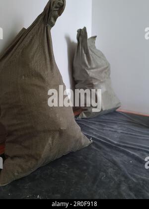 Garbage and waste from dismantling in bags for disposal. One of the ...