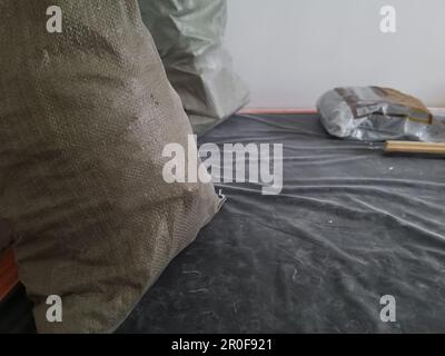 Garbage and waste from dismantling in bags for disposal. One of the ...