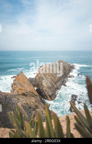 View of the rocky outcrops rising from the Atlantic Ocean in Odemira ...