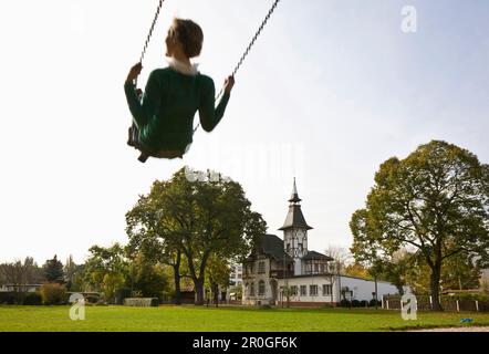 Woman swinging, German Allotment Gardener`s Museum, Leipzig, Saxony ...